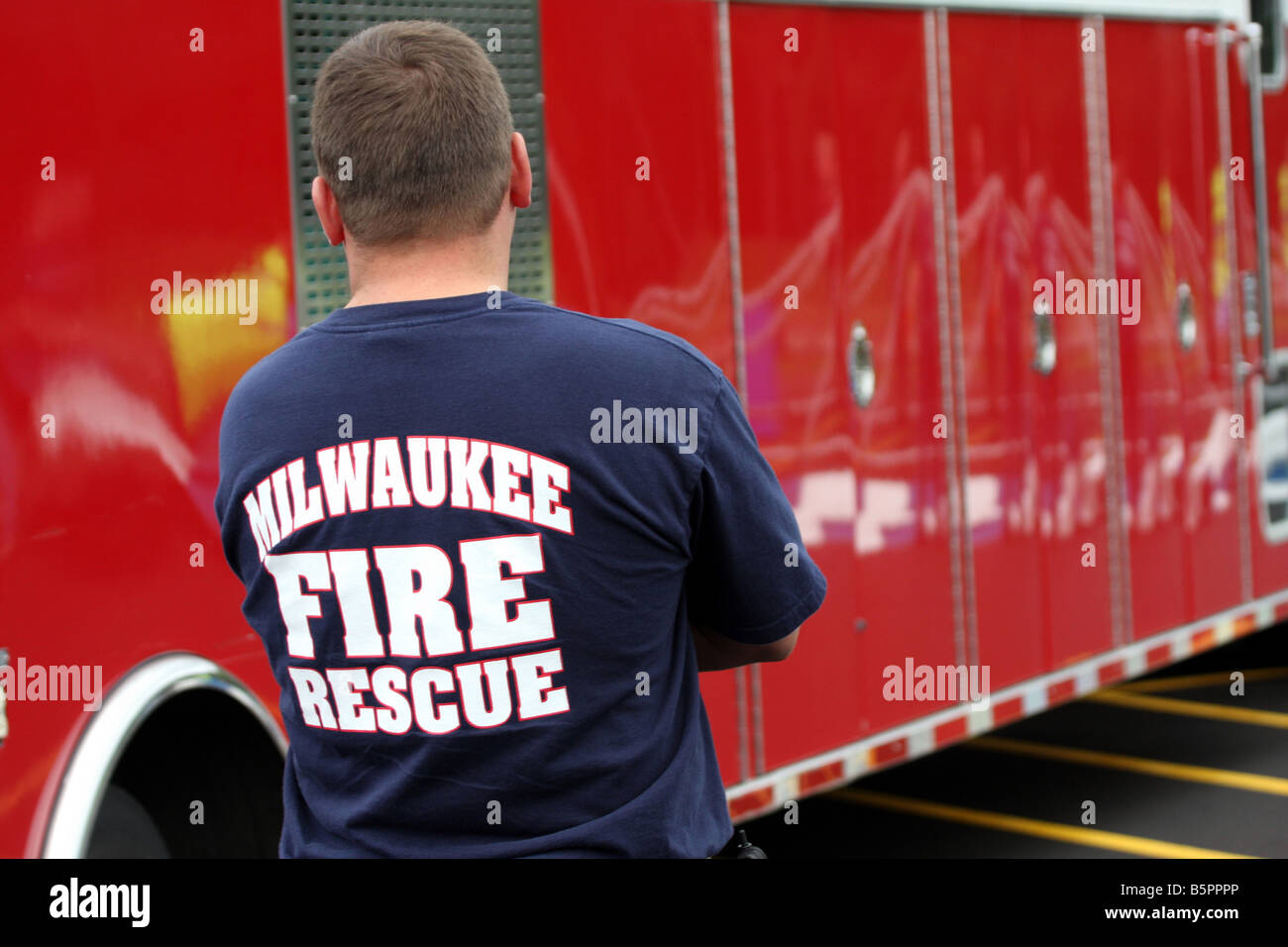 Personnel for the Milwaukee Fire Rescue T shirt standing in front of a ...