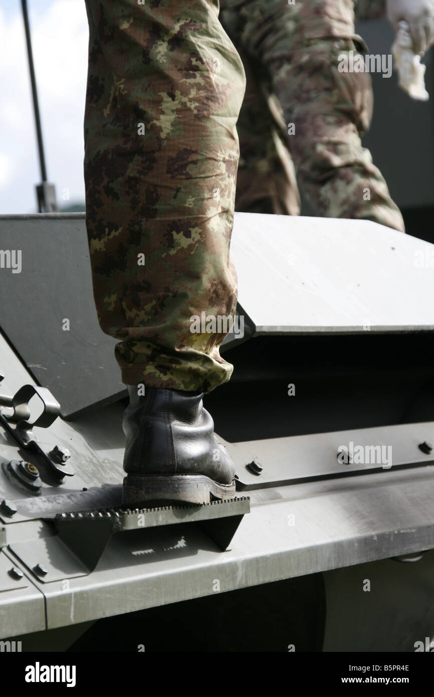 one soldier standing on armoured tank at open day Stock Photo - Alamy