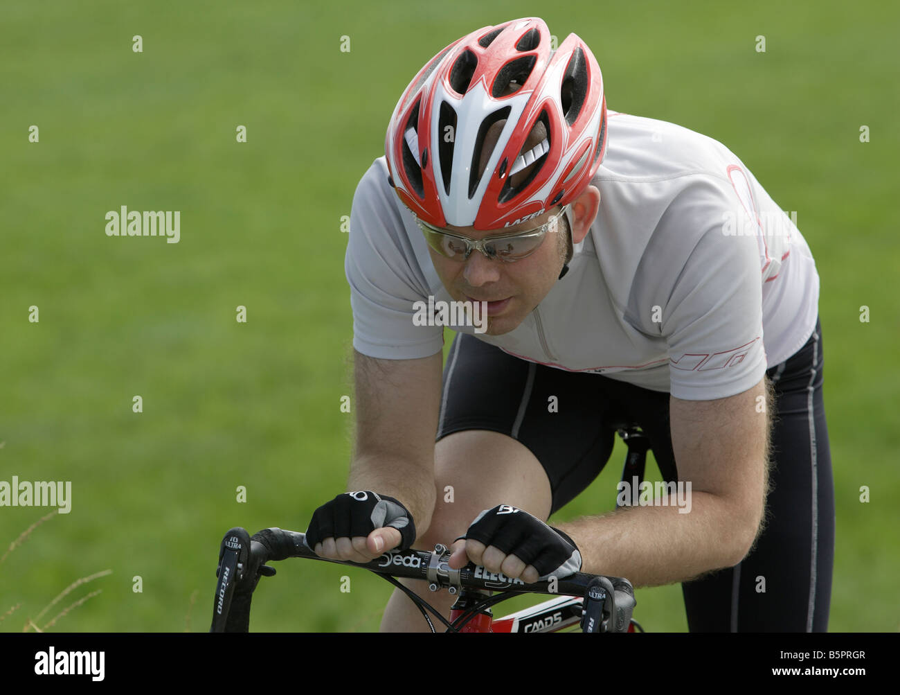 Racing cyclist wearing a helmet Stock Photo - Alamy