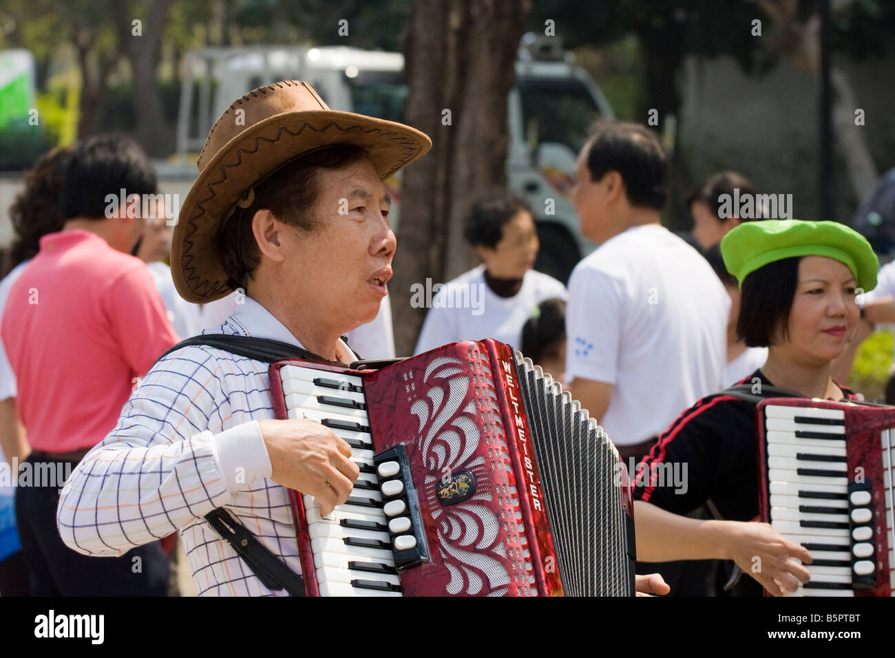 Man in cowboy hat plays hi-res stock photography and images - Alamy