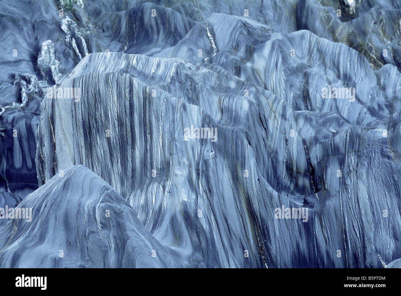 Wave like detail within the pale blue argillaceous slate rock cliffs at ...