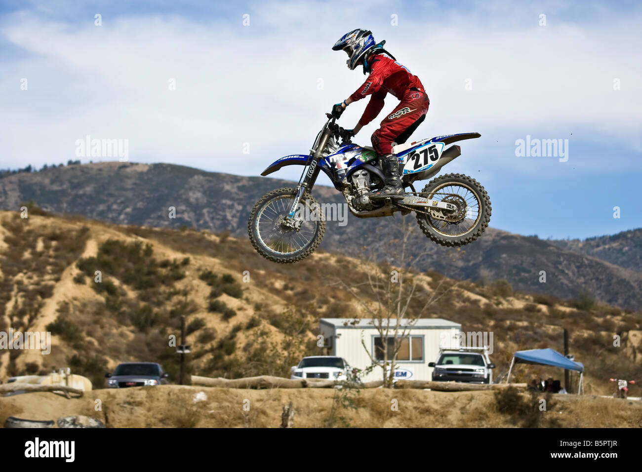 Motorcross rider jumping over a ramp at Glen Helen circuit Devore ...