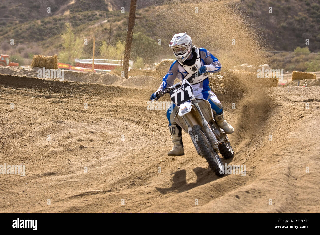 Motorcross rider sweeping through a bend at Glen Helen circuit Devore ...