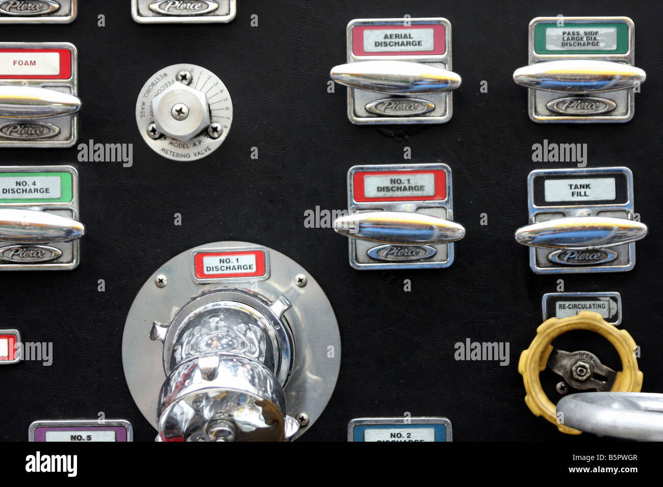 A control panel on the side of a fire truck that pumps water and foam ...