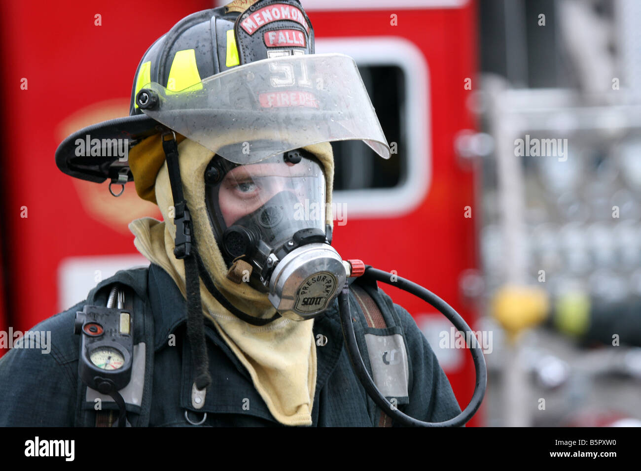 A firefighter looking through his breathing mask Stock Photo - Alamy