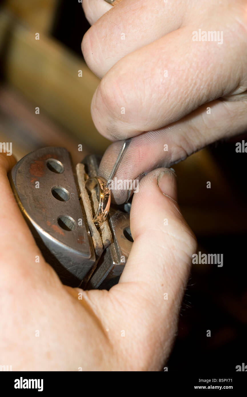 goldsmith working with engraving Stock Photo - Alamy