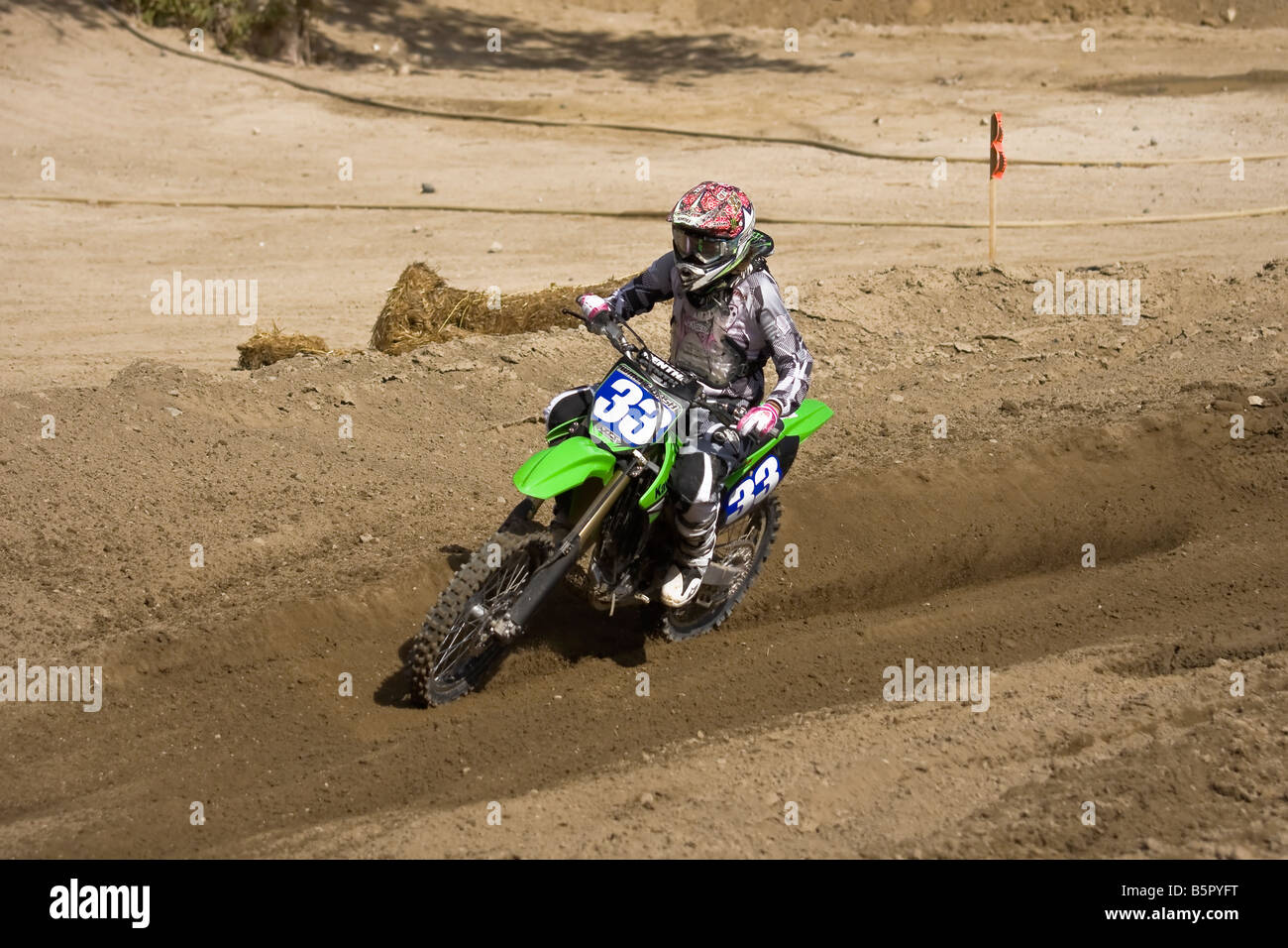 Motorcross rider sweeping through a bend at Glen Helen circuit Devore ...