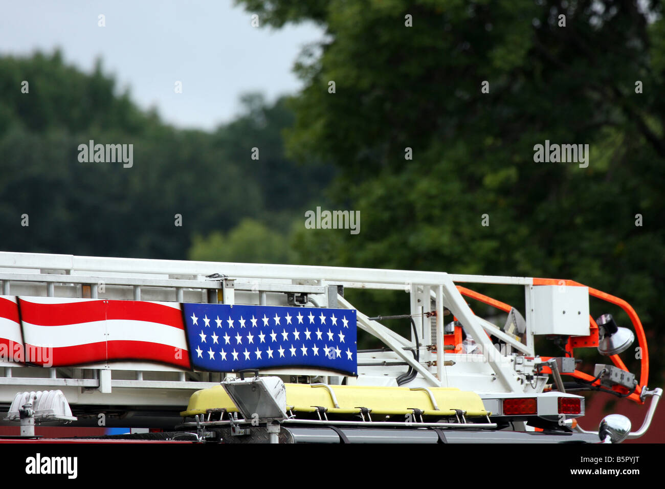 An American Flag Banner on the ladder apparatus of a ladder truck Stock ...