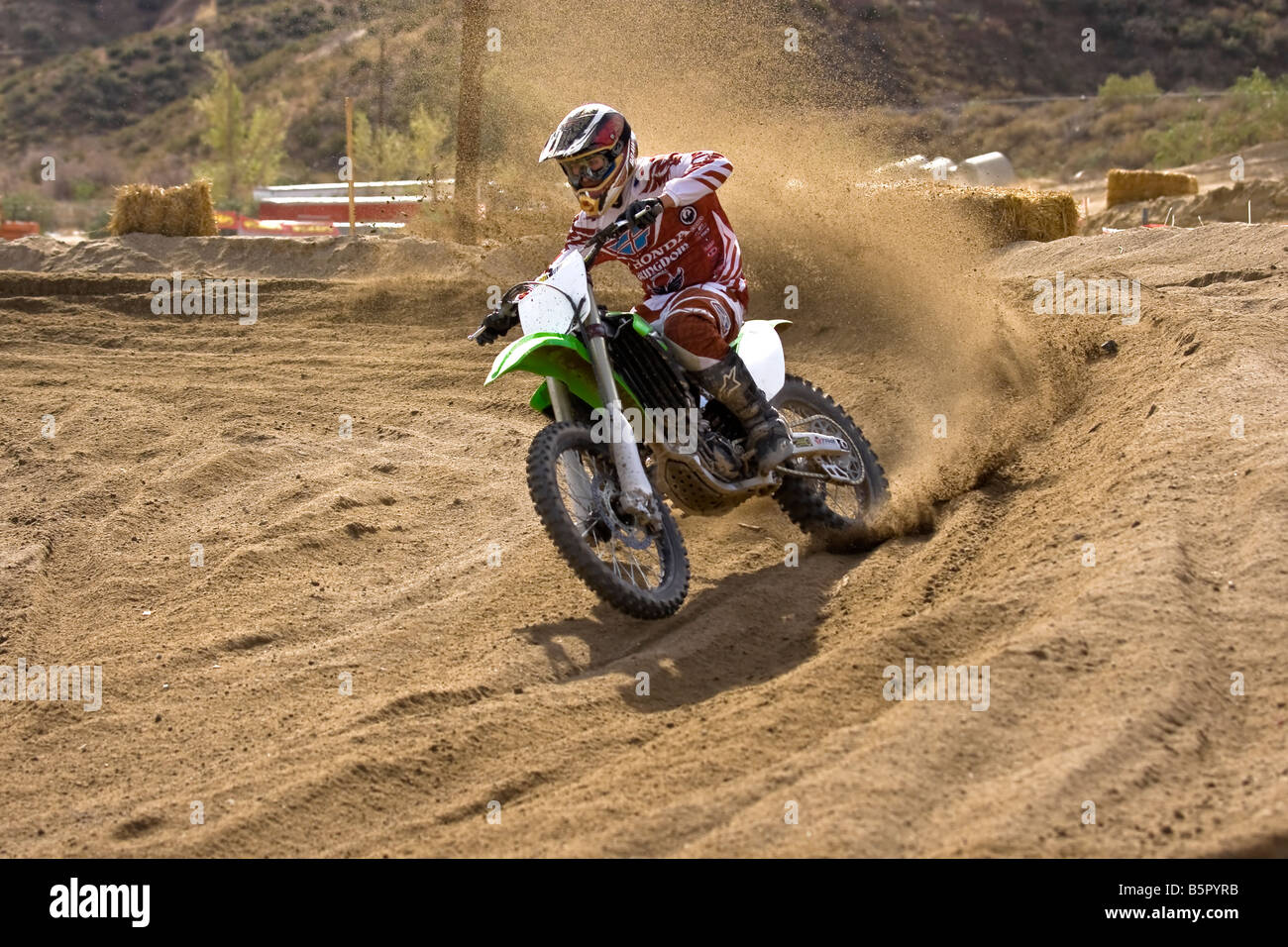 Motorcross rider sweeping through a bend at Glen Helen circuit Devore ...