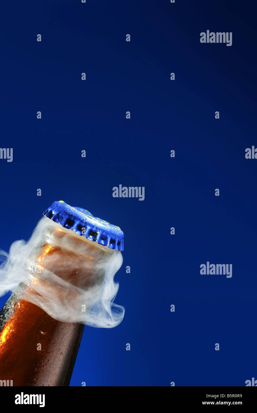 A lid takes off from the bottle of beer Stock Photo - Alamy