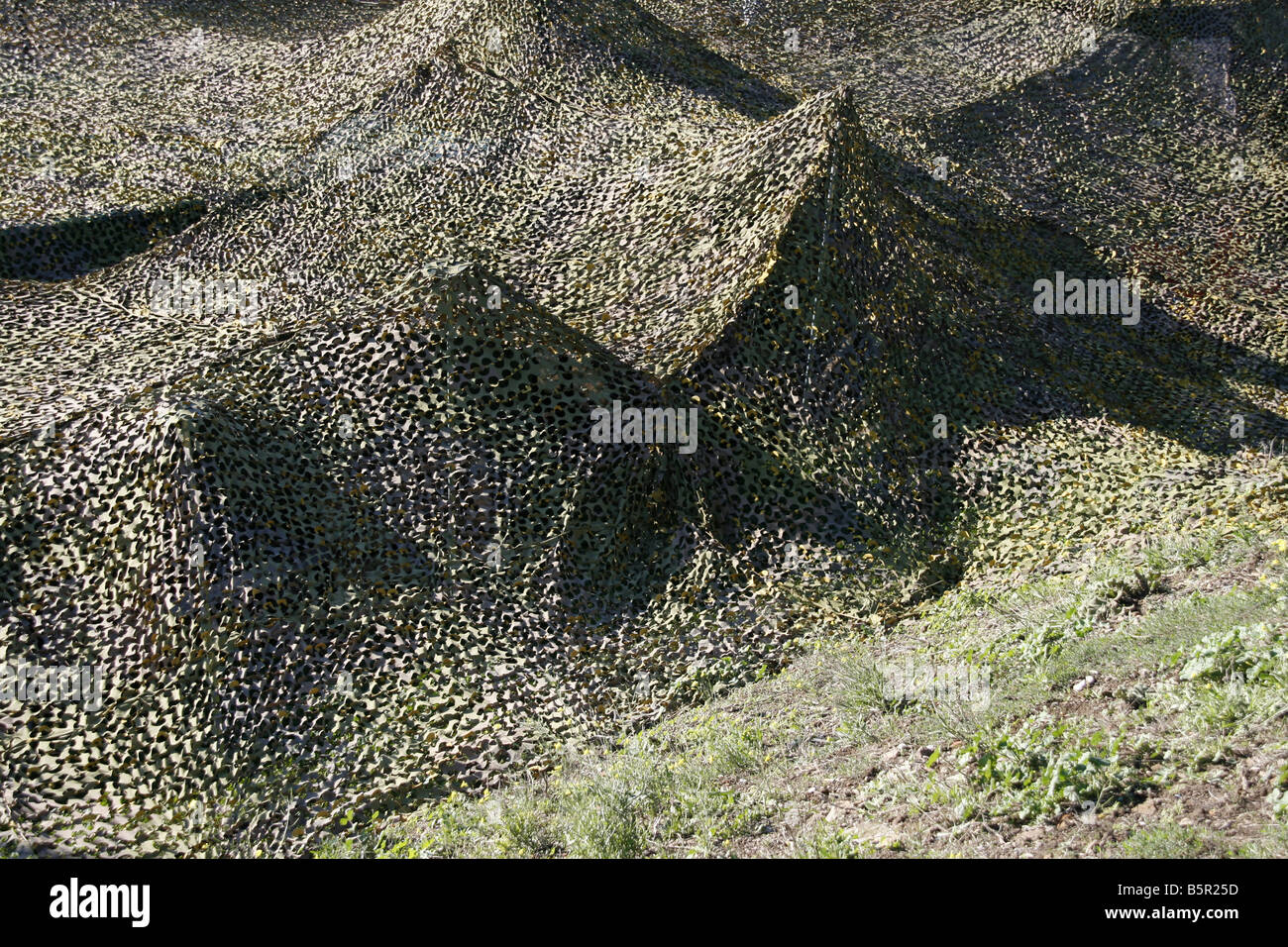 camouflage military army base tent at open day Stock Photo - Alamy
