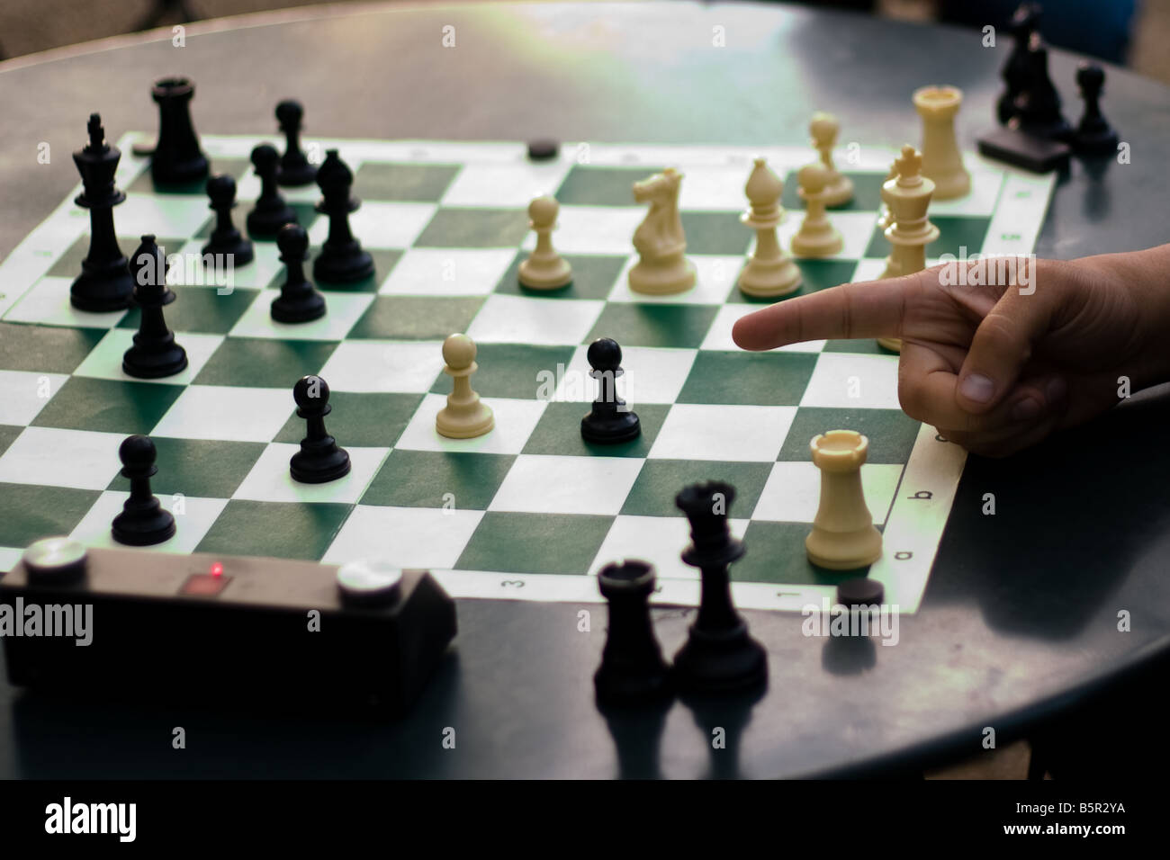 Pointing out a chess move Stock Photo - Alamy