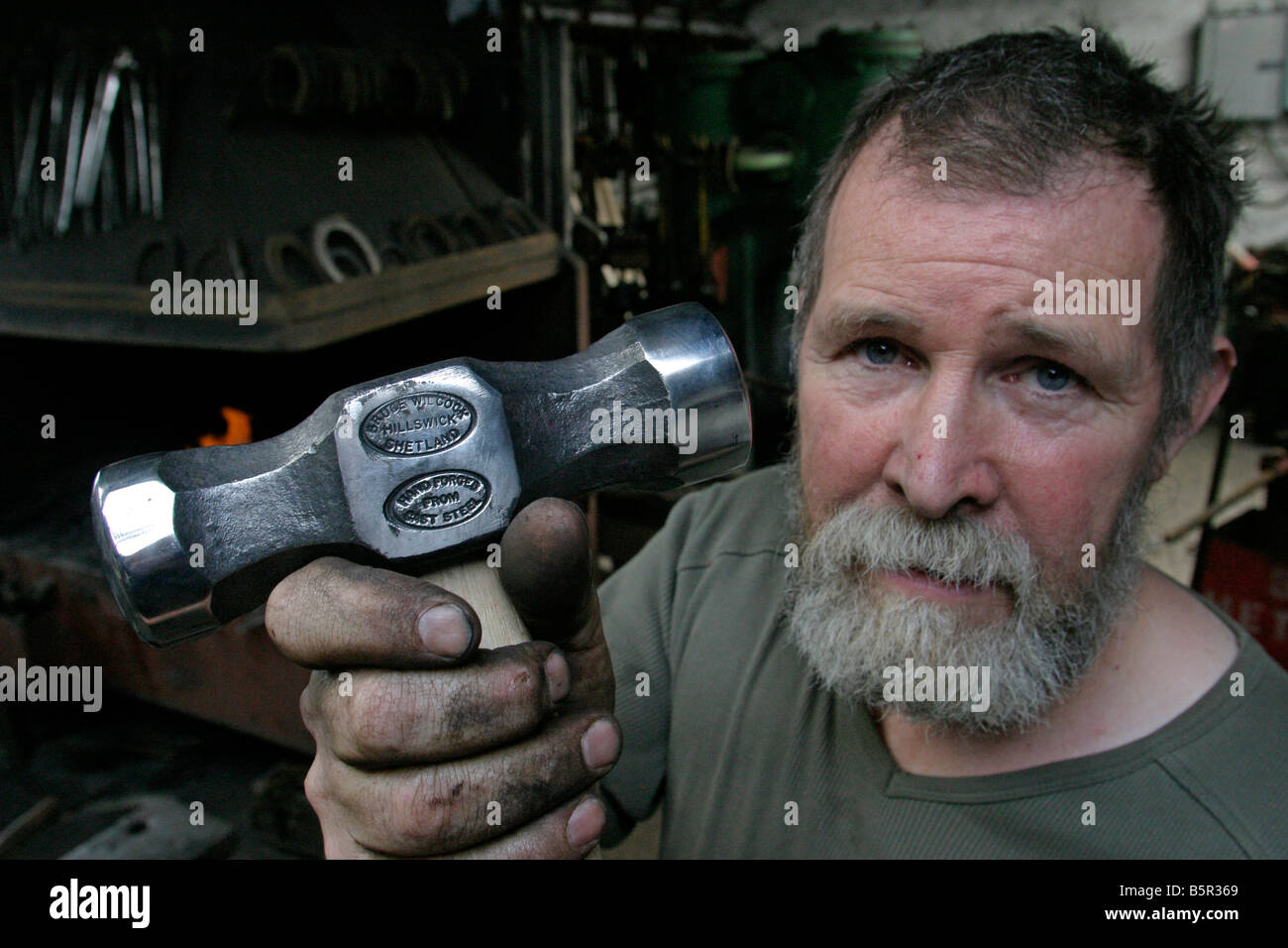 Blacksmith Bruce Wilcock at work in his Forge making a hammer Stock ...