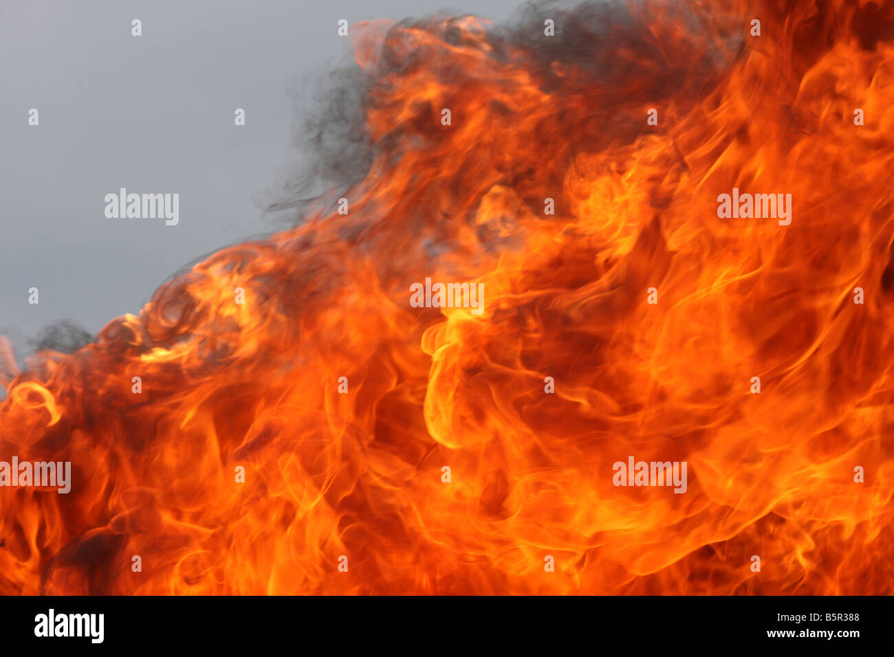 Smoke and flames during a fire Stock Photo - Alamy