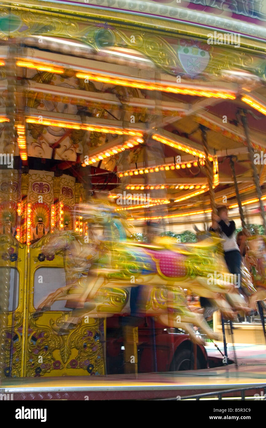 Merry go round in motion in the market town of Stratford upon Avon ...