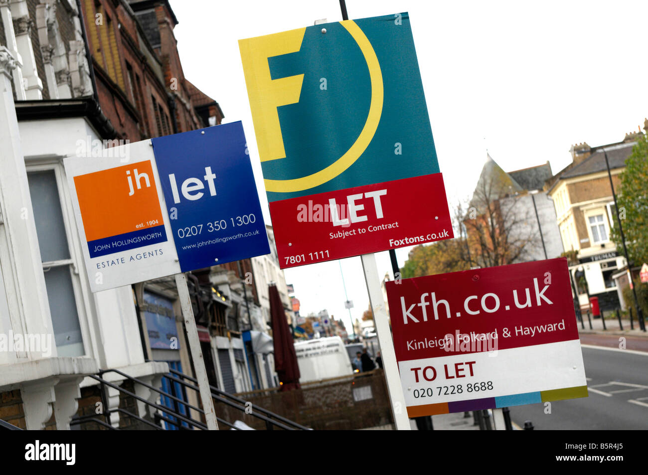 A row of to let and for sale signs outside a maisonette in London ...