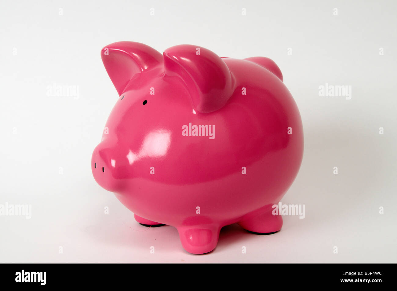 half side profile of a pink piggy bank on a white background Stock ...