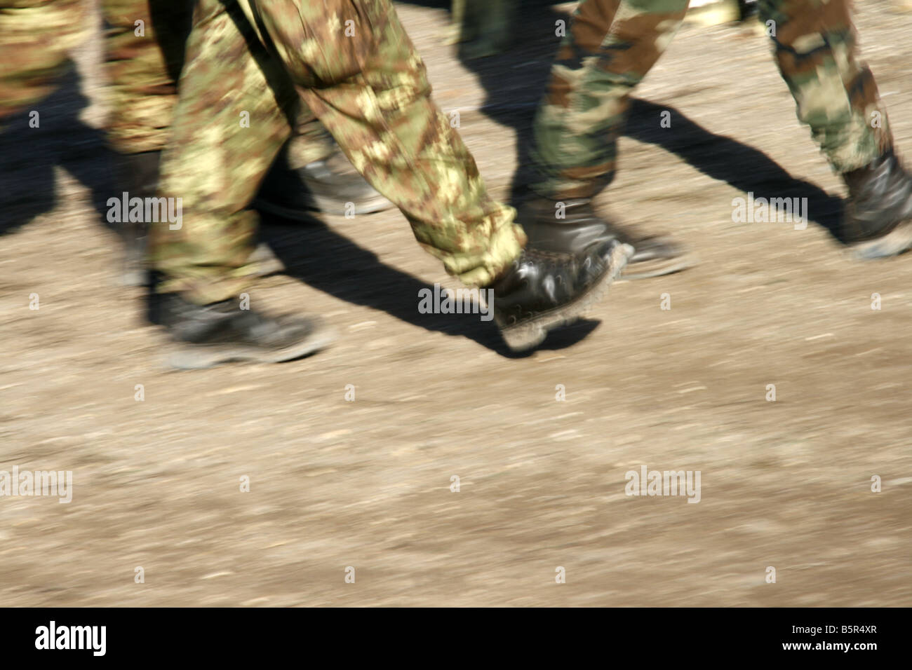 many soldiers feet marching on battlefield Stock Photo - Alamy