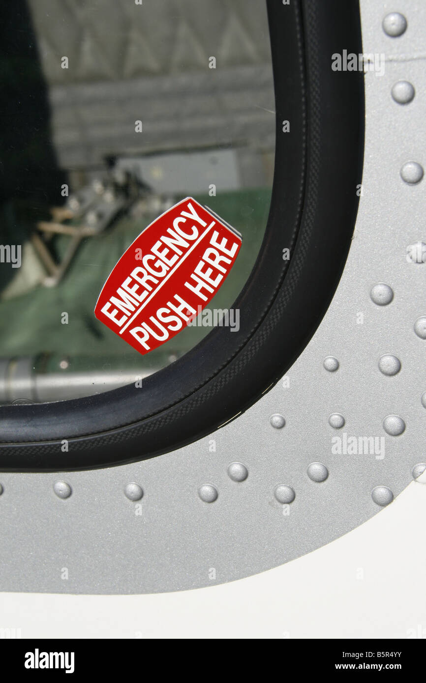 emergency exit push sign notice on helicopter window Stock Photo - Alamy