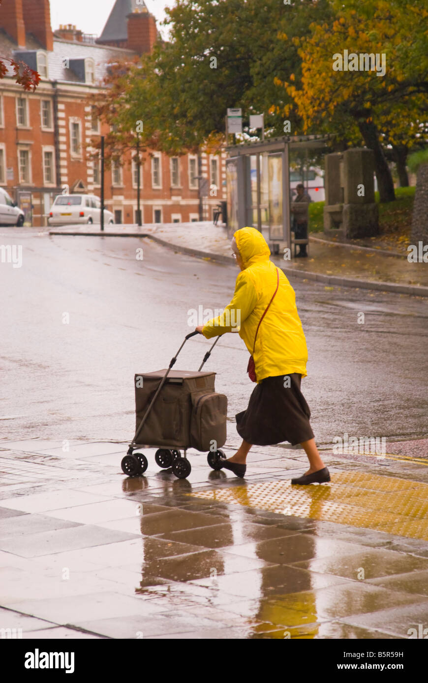 Woman getting wet in rain hi-res stock photography and images - Alamy