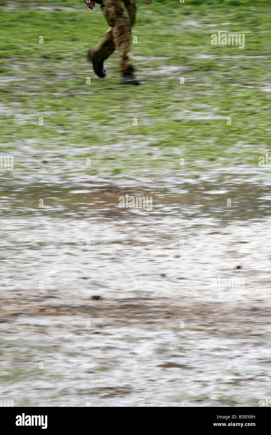 one single soldier feet marching on battlefield Stock Photo - Alamy