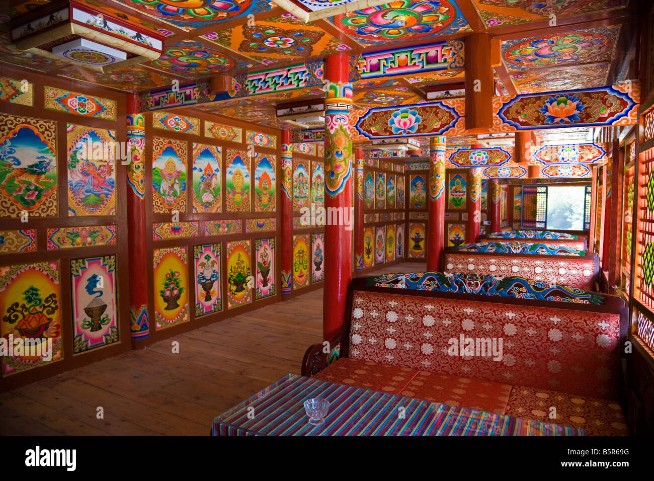 Interior of brightly painted Tibetan tea house in Jiuzhaigou nature reserve Sichuan Province ...