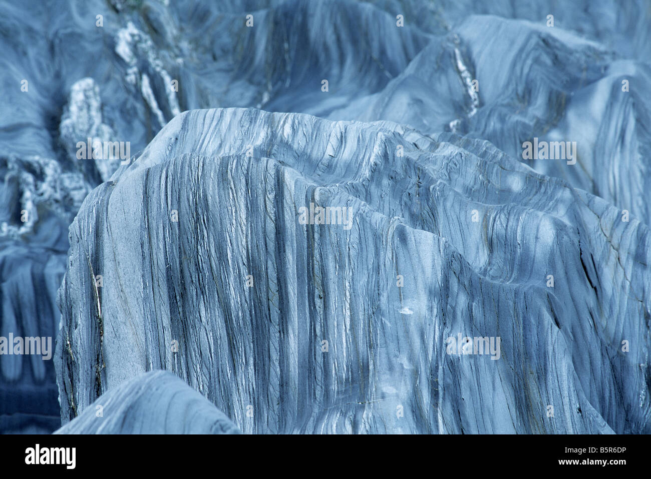Wave like detail within the pale blue argillaceous slate rock cliffs at ...