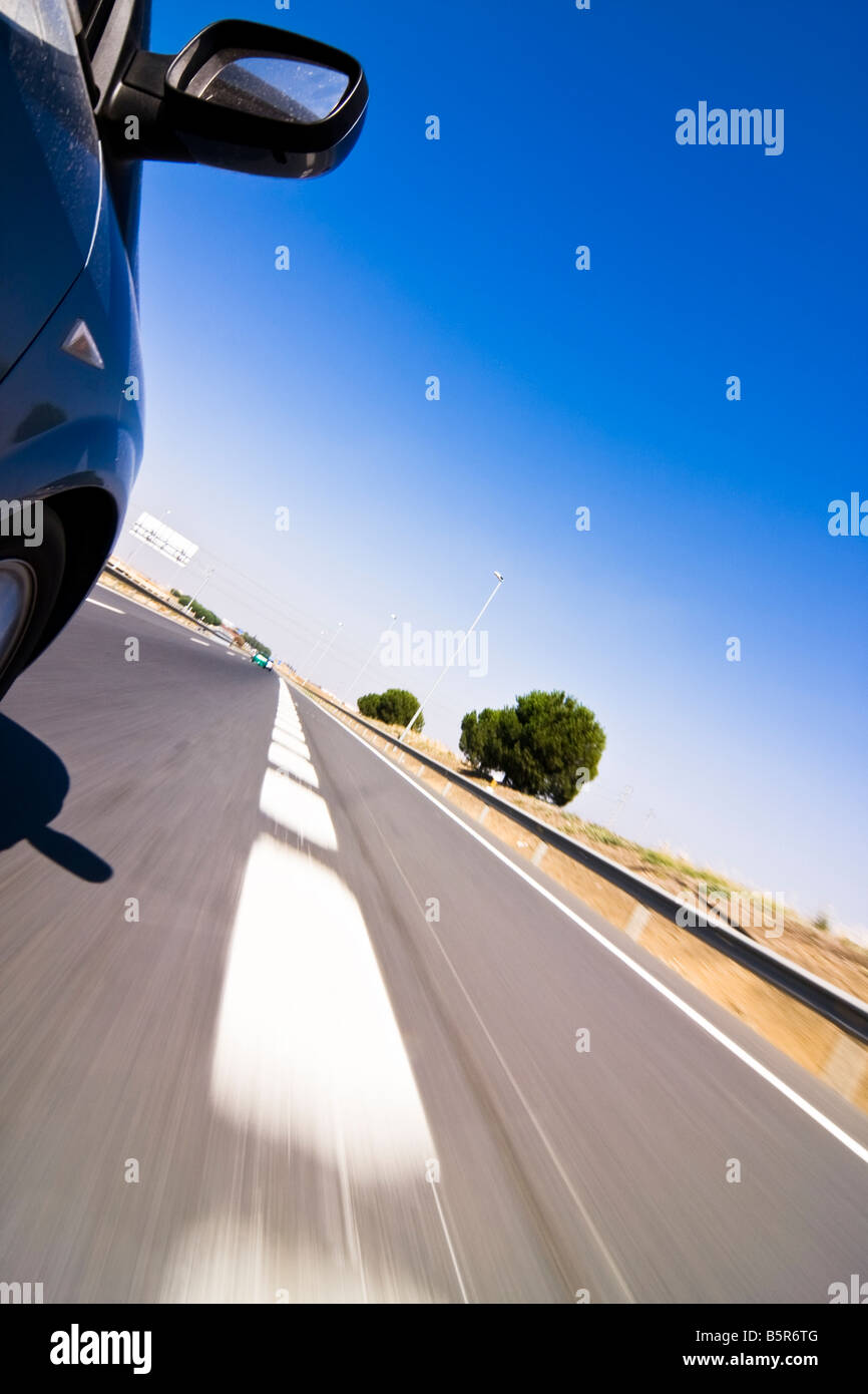 Blue car at high speed on the road Stock Photo - Alamy