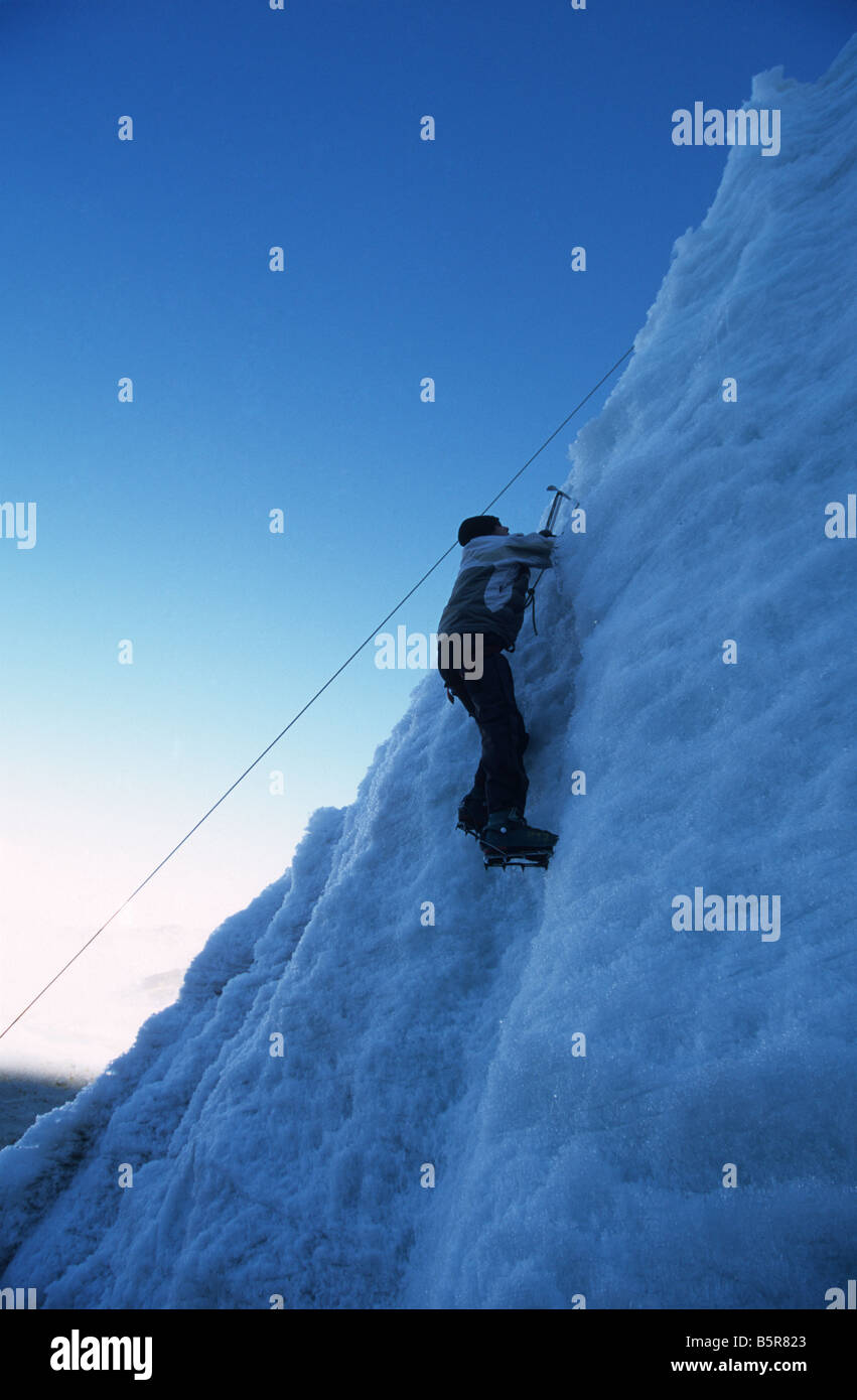 Climber practicing ice climbing on glacier, Mt Huayna Potosi ...