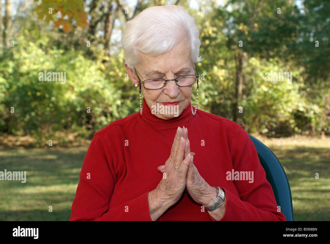 Praying in Nature Stock Photo - Alamy