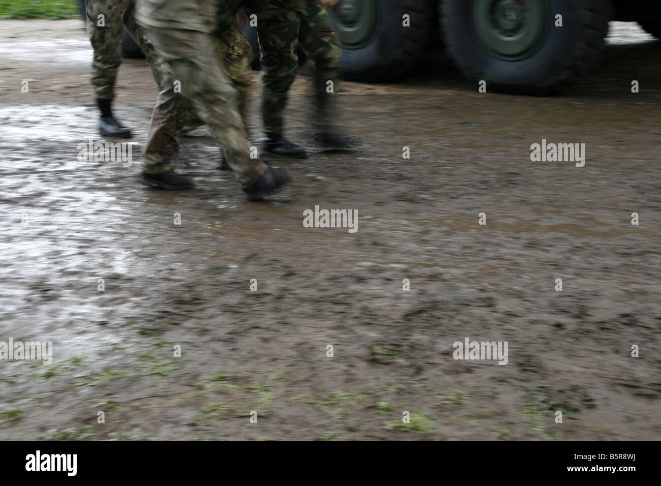 many soldiers feet marching on battlefield Stock Photo - Alamy