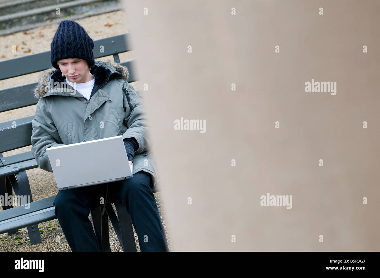 young male using laptop computer Stock Photo - Alamy