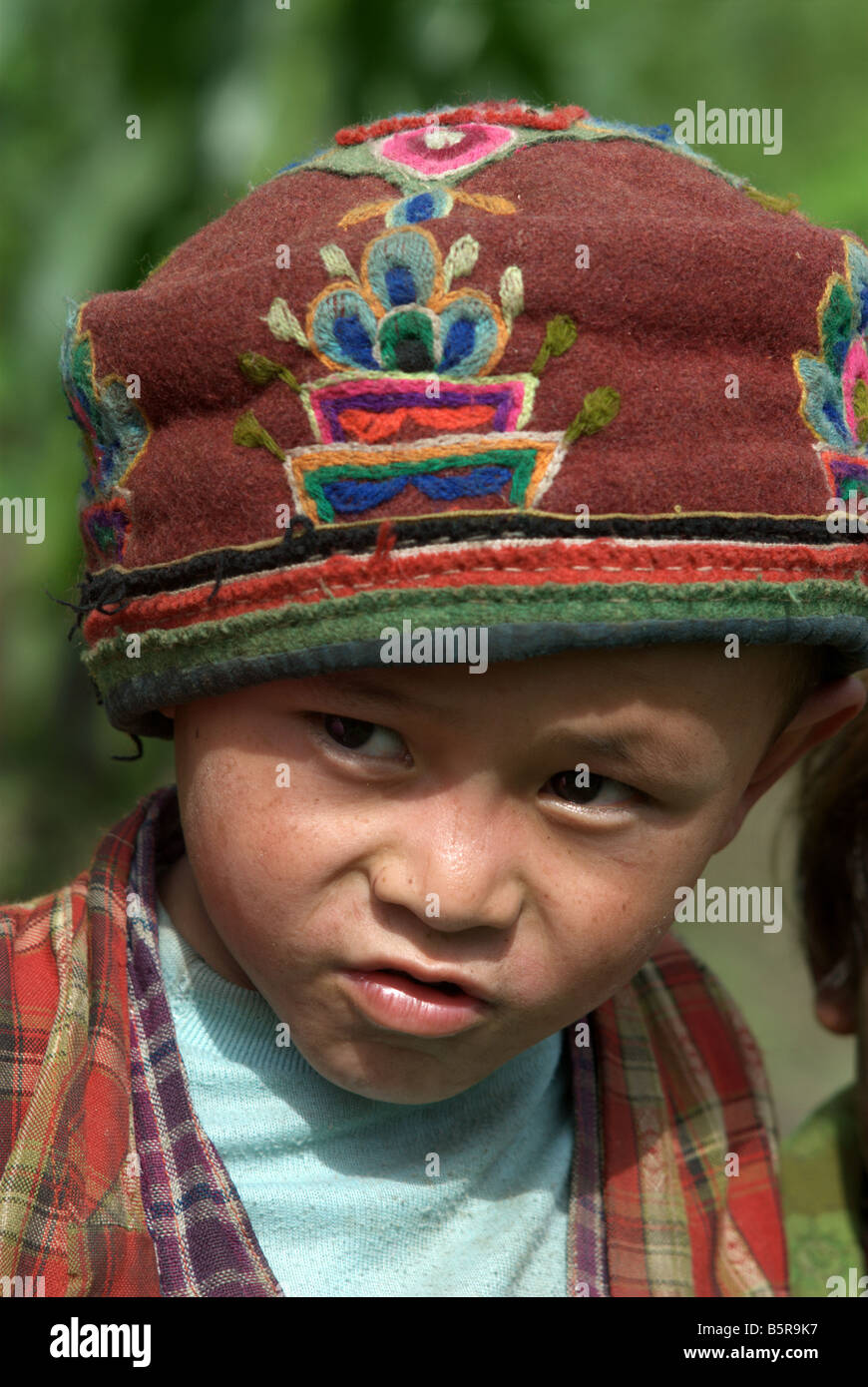 A small Tamang girl is warily watching a foreign visitor, Gatlang ...