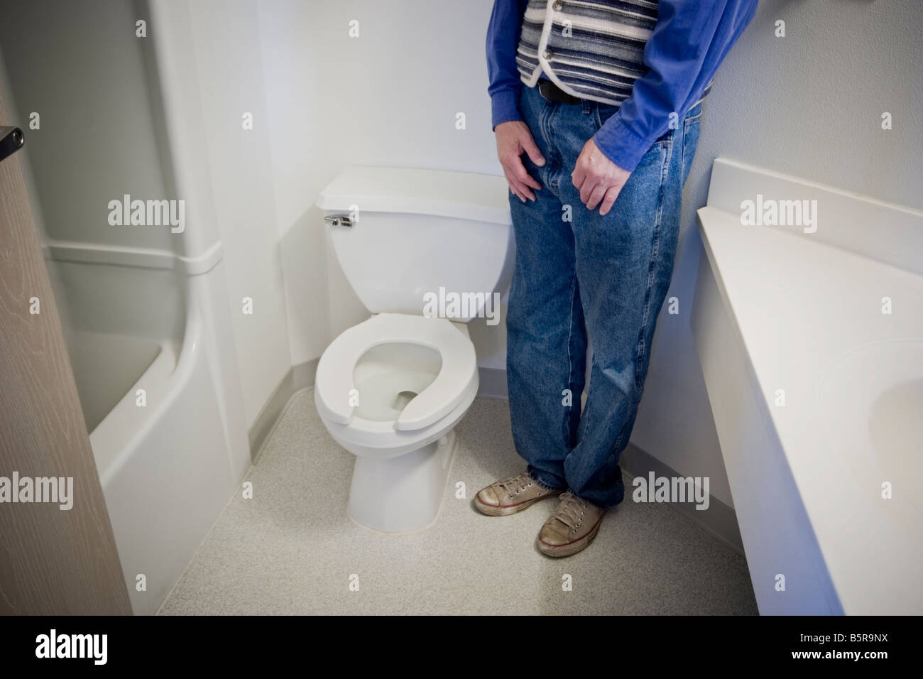 Person waiting for toilet hi-res stock photography and images - Alamy