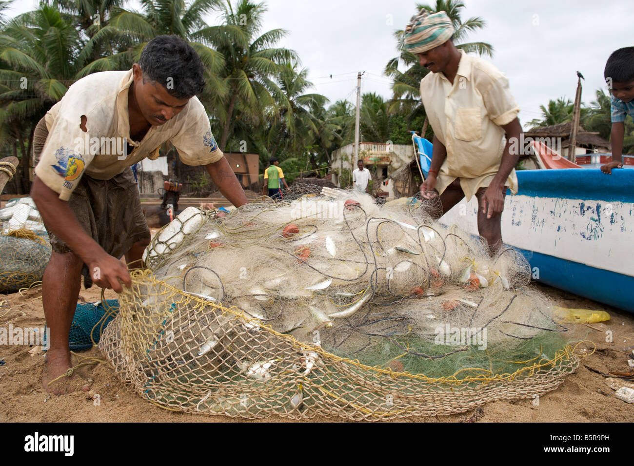 Fishermen on Kalapet beach near Pondicherry India Stock Photo - Alamy