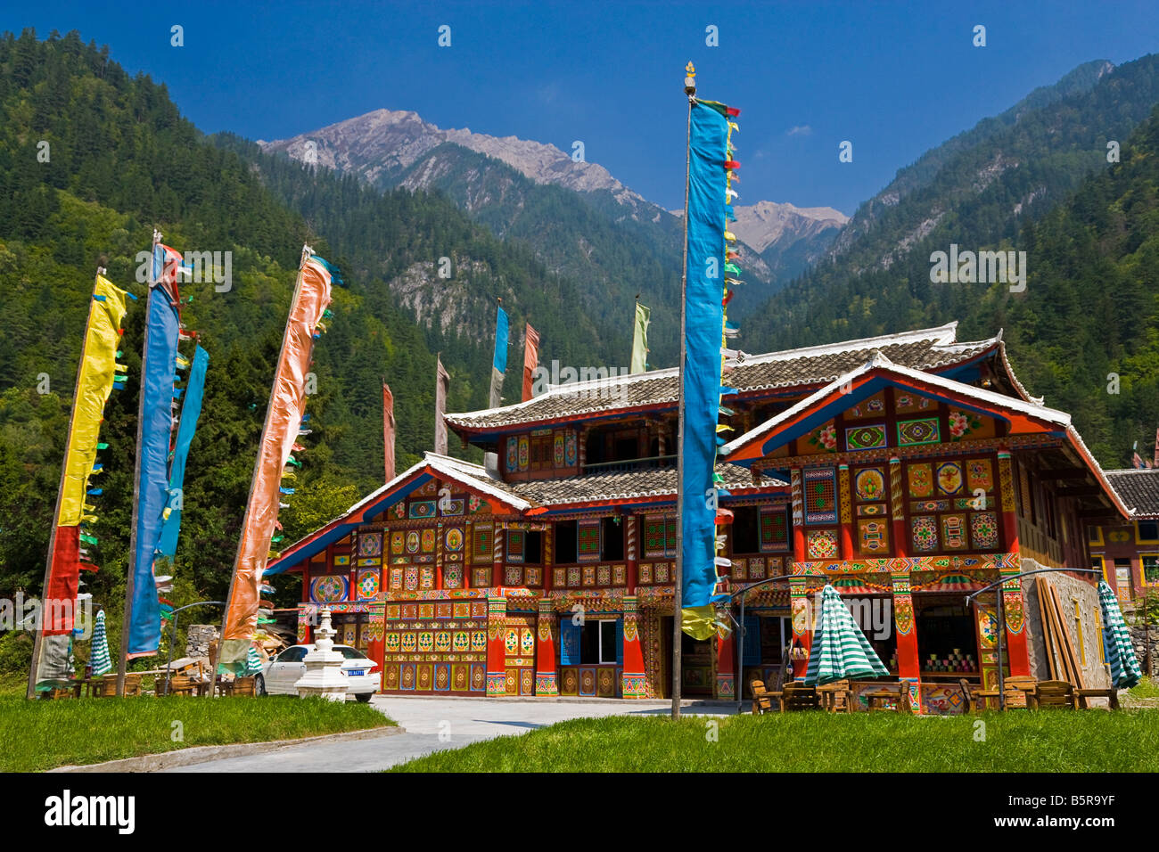 Brightly painted Tibetan tea house in Jiuzhaigou nature reserve Sichuan ...