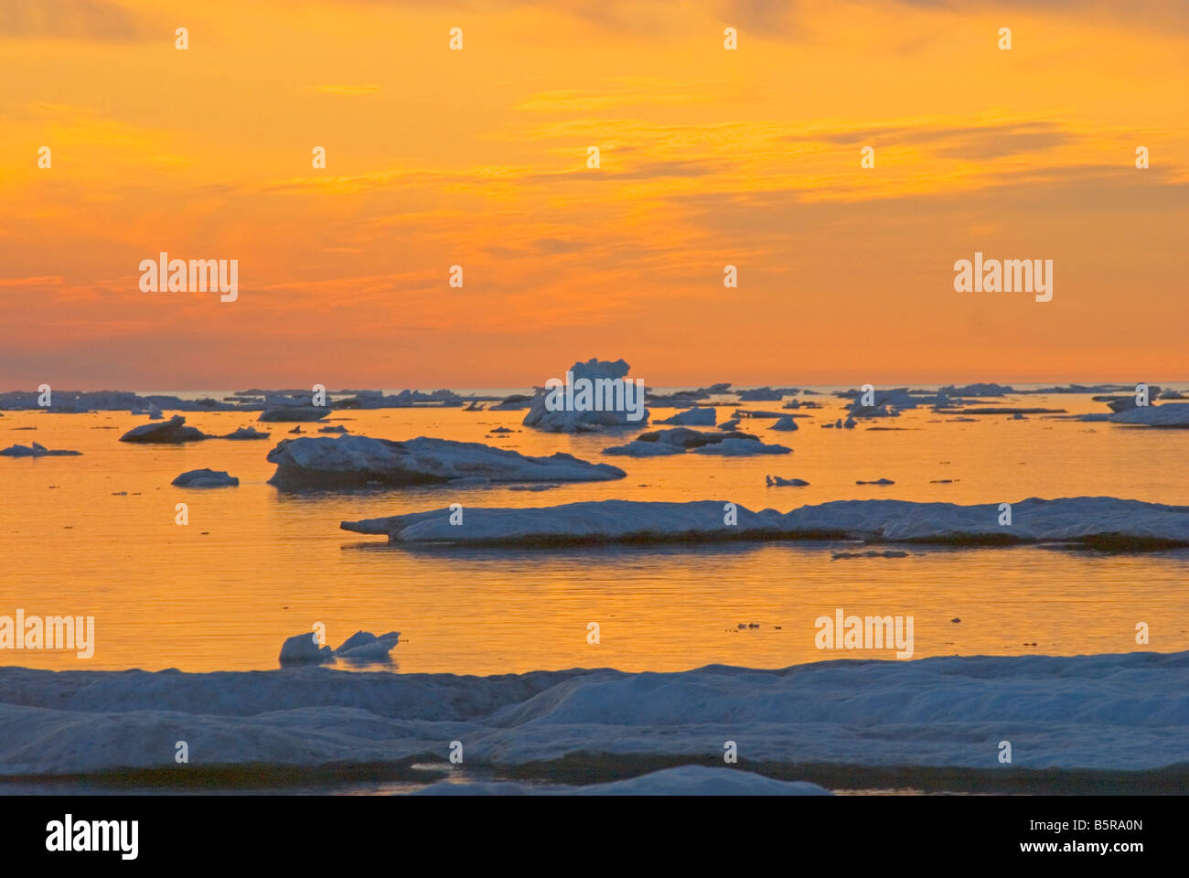 melting shorefast ice in the Beaufort Sea at sunset Arctic Ocean off ...