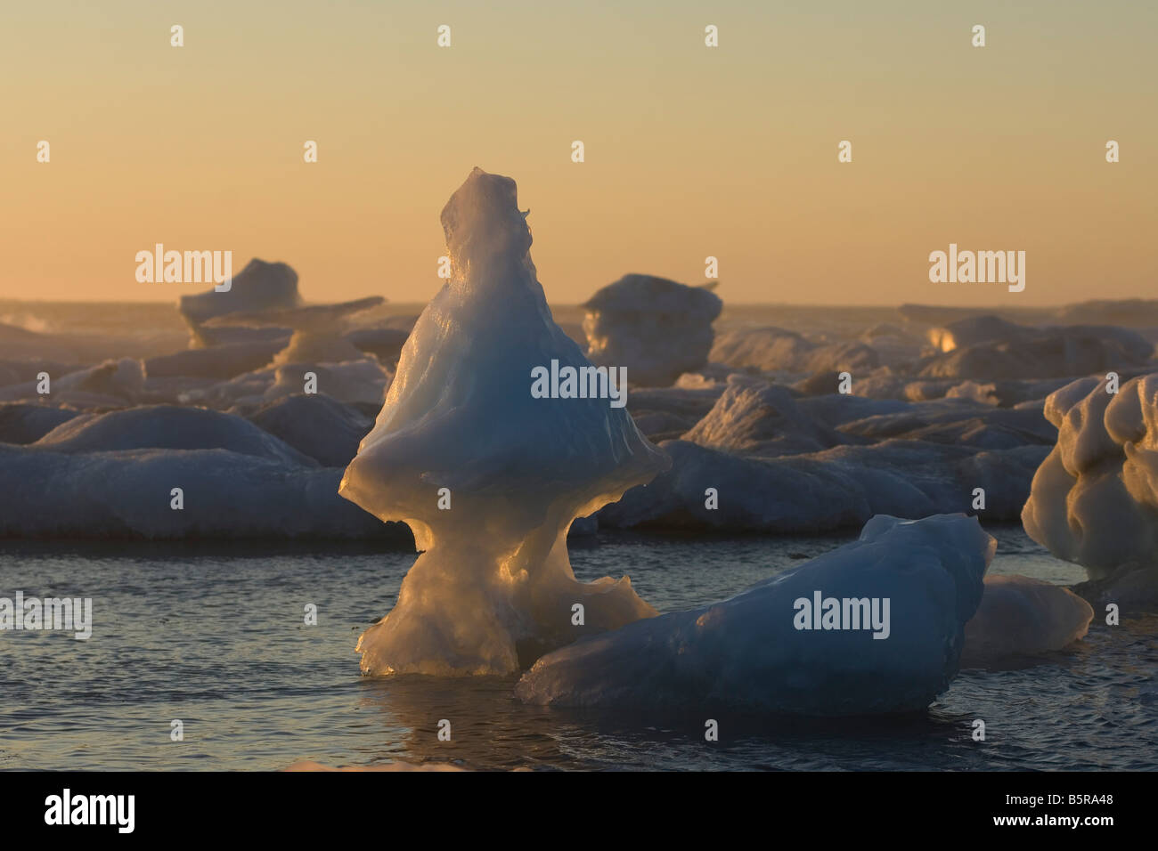 melting shorefast ice in the Beaufort Sea at sunset Arctic Ocean off ...
