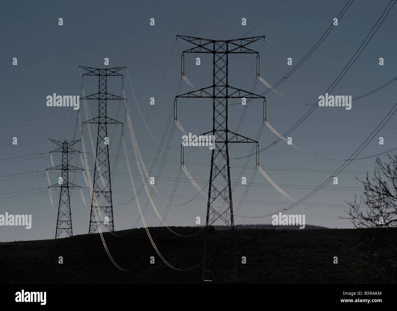 Electricity pylons and power cables stretch over the Spanish landscape ...