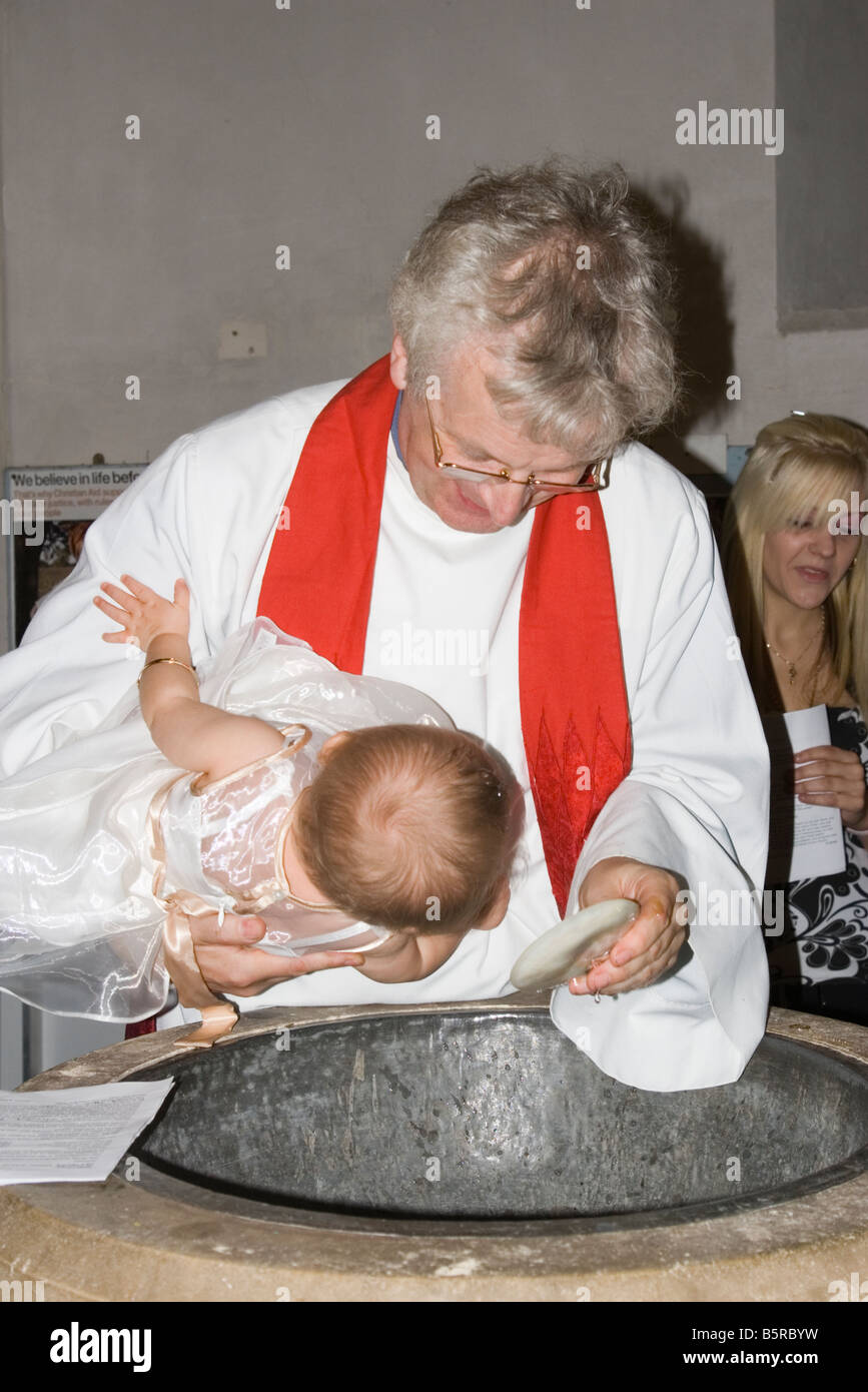Priest baptizing girl hi-res stock photography and images - Alamy