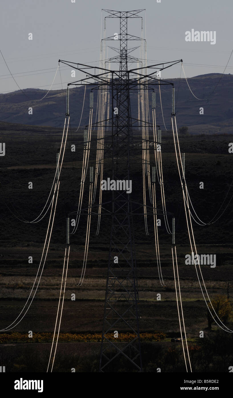 Electricity pylons and power cables stretch over the Spanish landscape ...