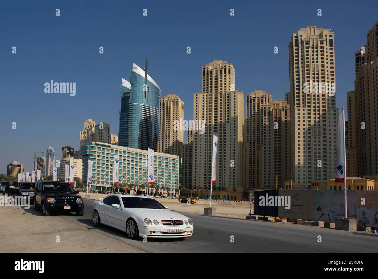 Dubai. Modern high rise buildings and luxury cars Stock Photo - Alamy