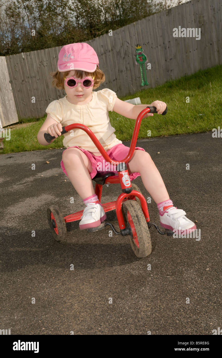 Child on tricycle hi-res stock photography and images - Alamy