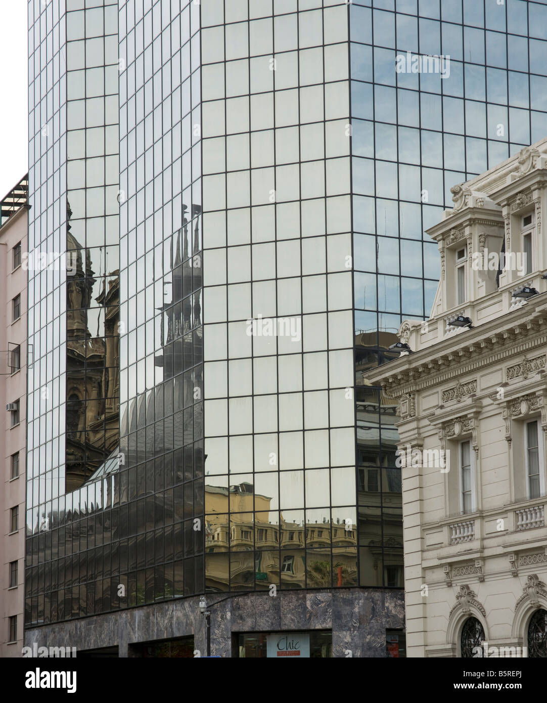 Reflection of the Catedral Metroplitana in a modern glass fronted ...