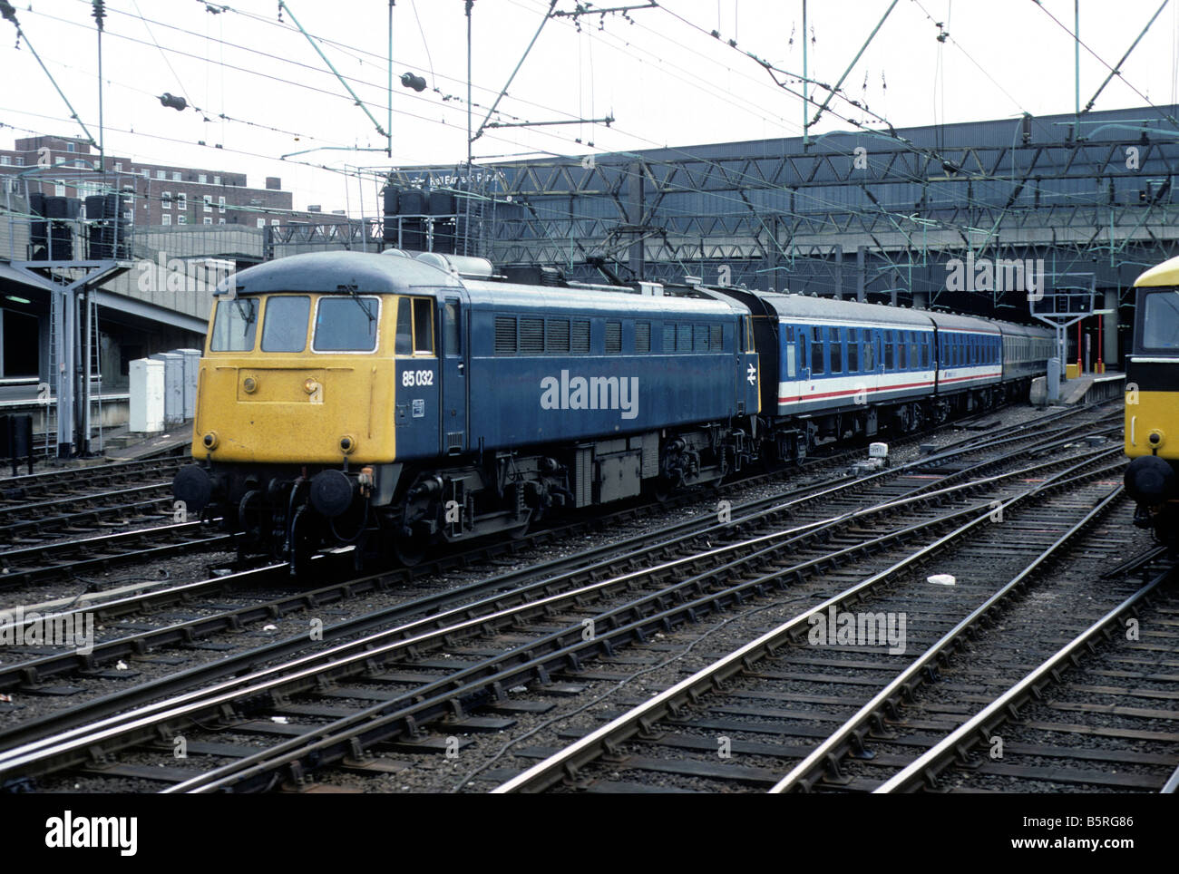 Class 85 electric locomotive hauling train from London Euston station ...