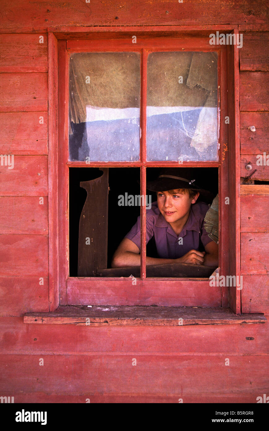 Boy at window Stock Photo - Alamy
