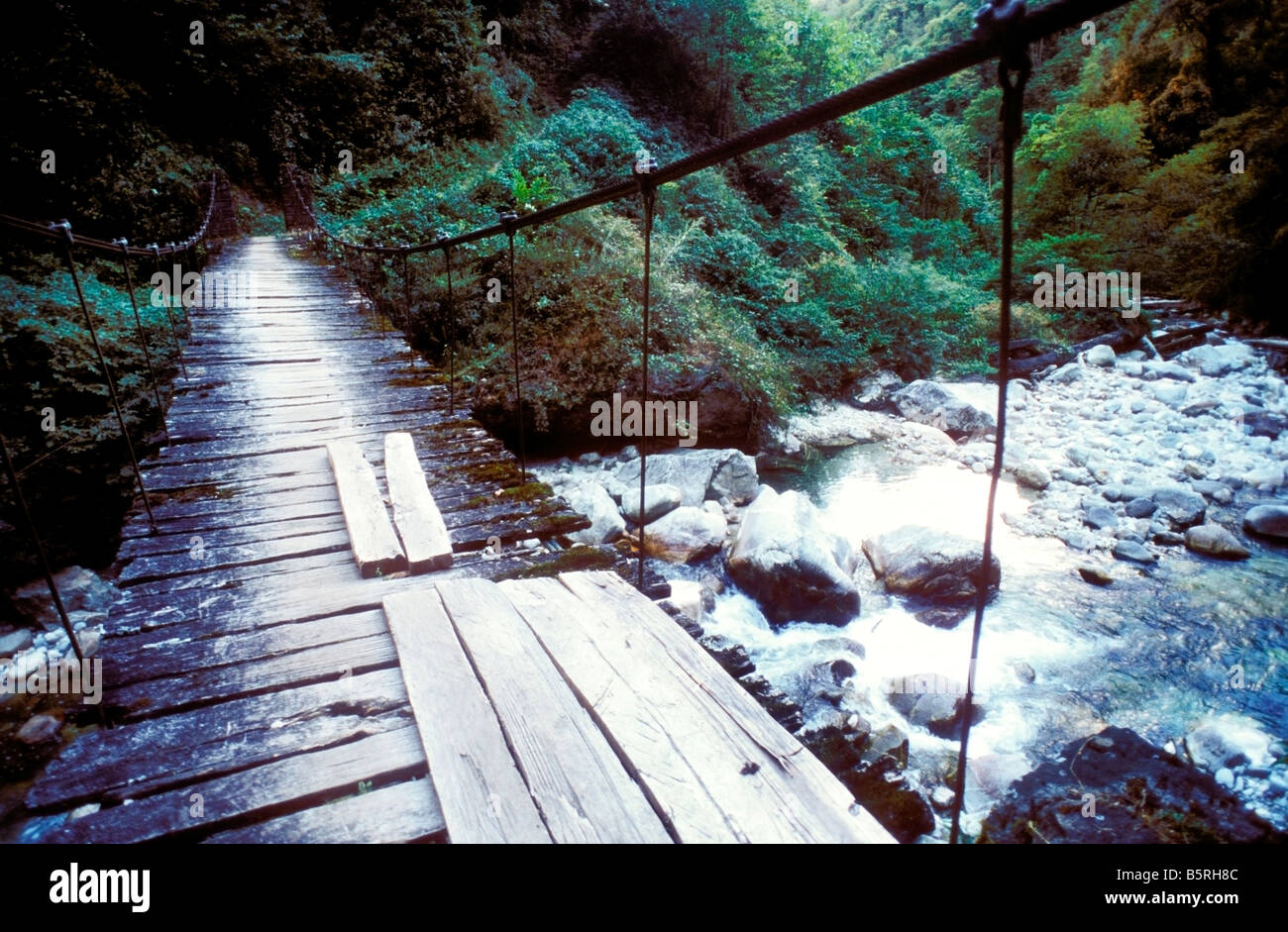 Narrow wooden bridge over stream hi-res stock photography and images ...