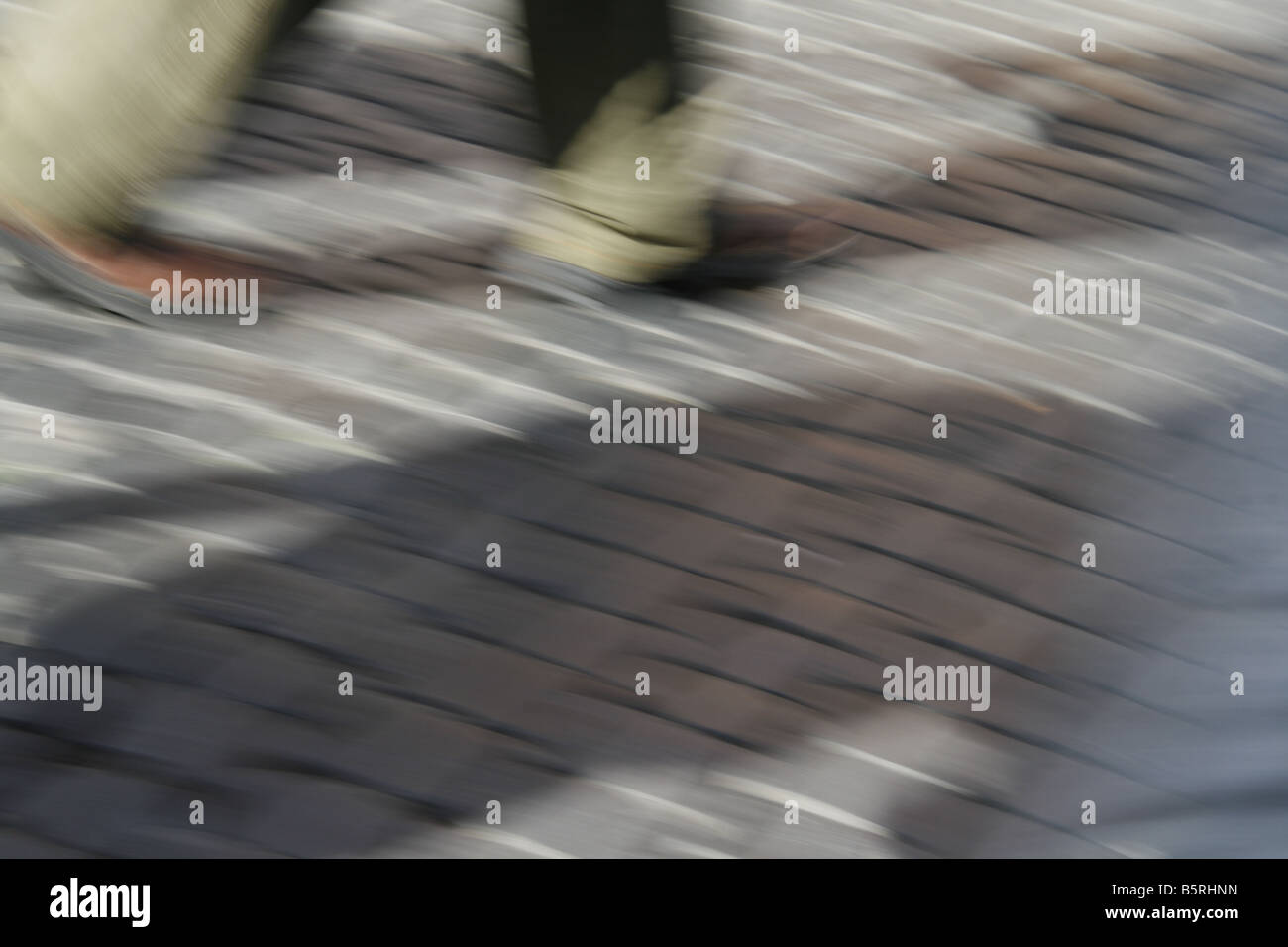person walking in street road in city town Stock Photo - Alamy