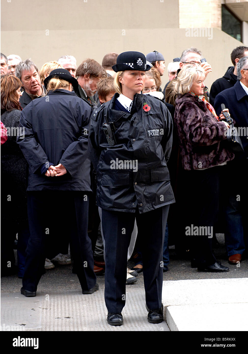 A sad looking female Police officer on duty at the Cenotaph in London ...
