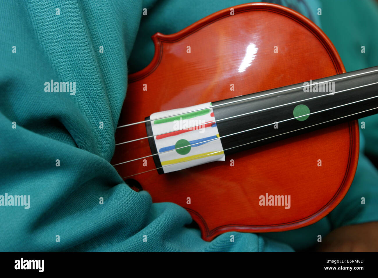 detail of primary age child with violin Stock Photo - Alamy